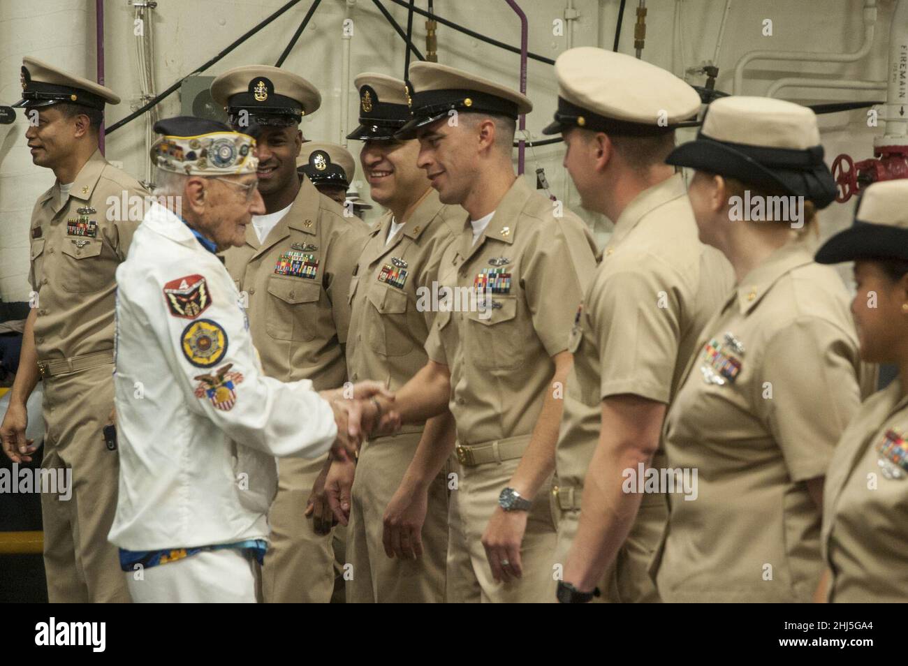 Stu Hedley, a retired Navy Chief Petty Officer, shakes hands with Chief ...