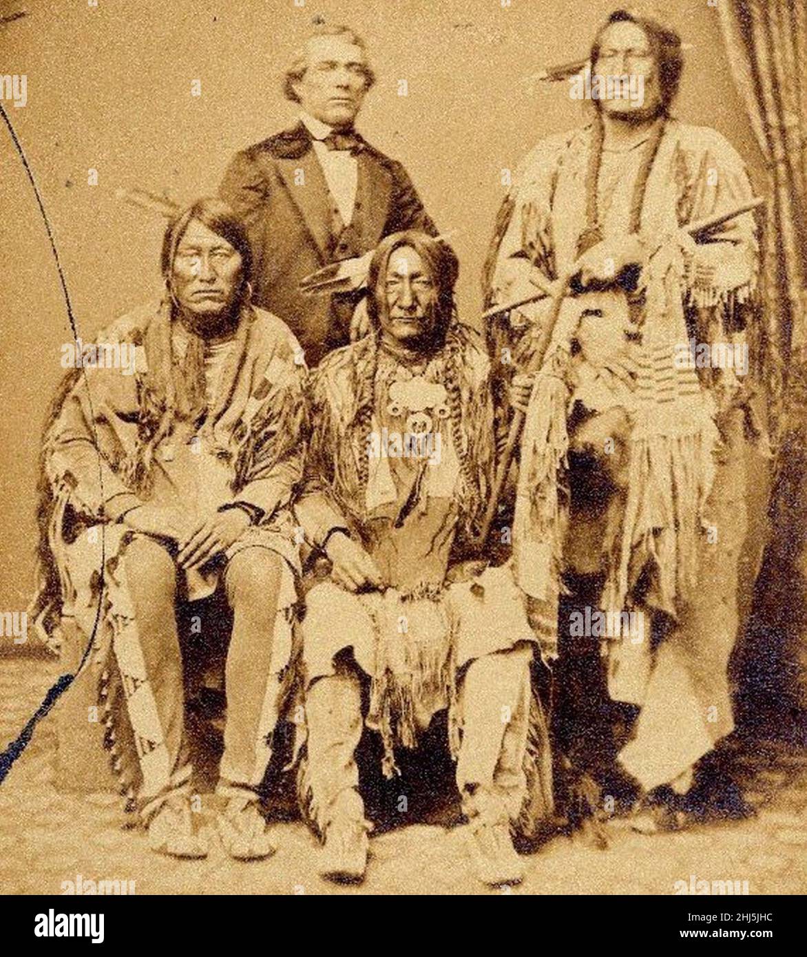 Studio photograph of three Cheyenne chiefs and an interpreter (cropped ...