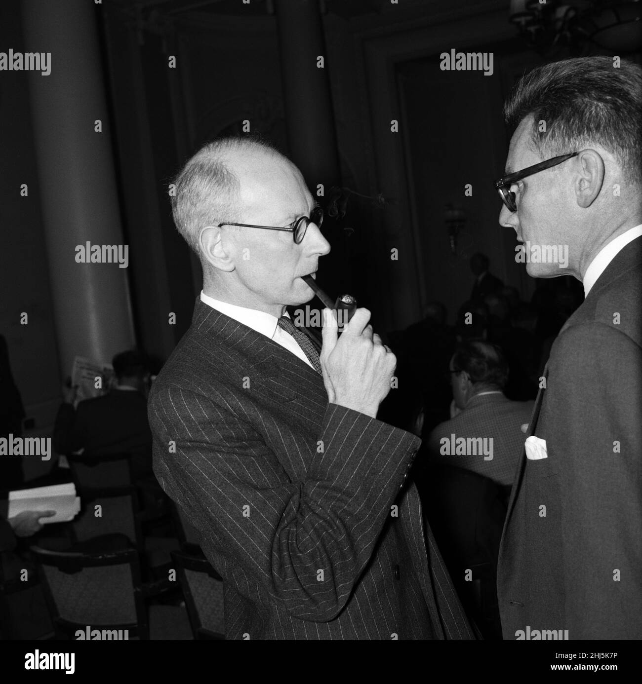 Lord Wolfenden (centre) meets members of the press at the Waldorf Hotel ...