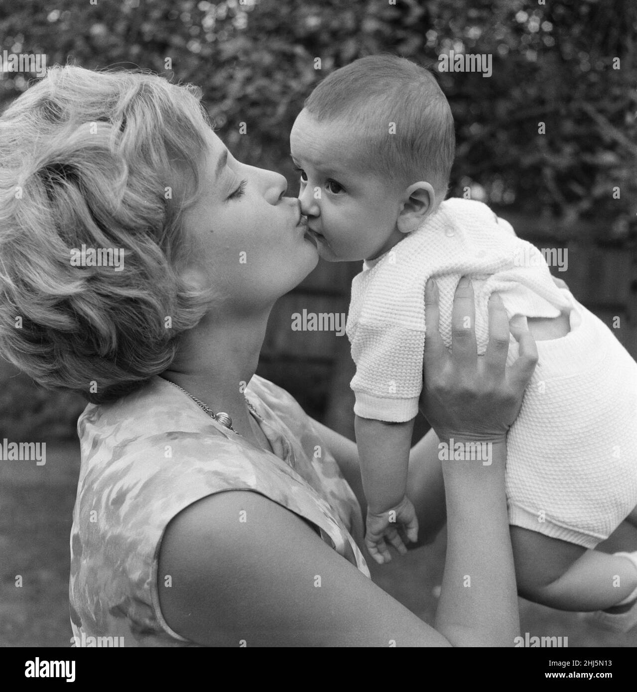 Sylvia Syms, actor and star of Ice Cold In Alex, with her adopted son ...
