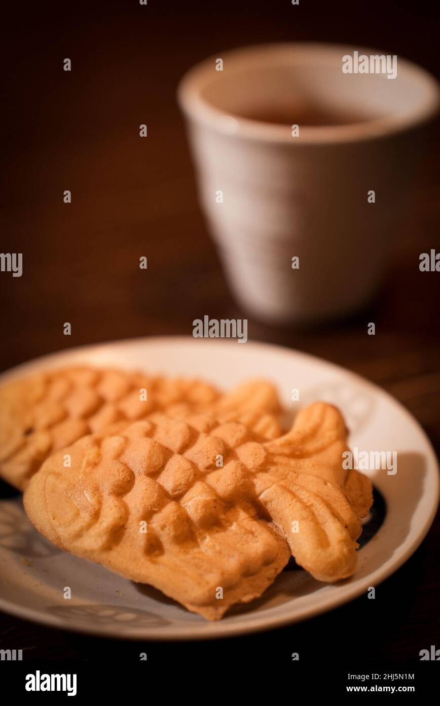 A decorated plate with 2 famous Japanese fish-shaped confections ...
