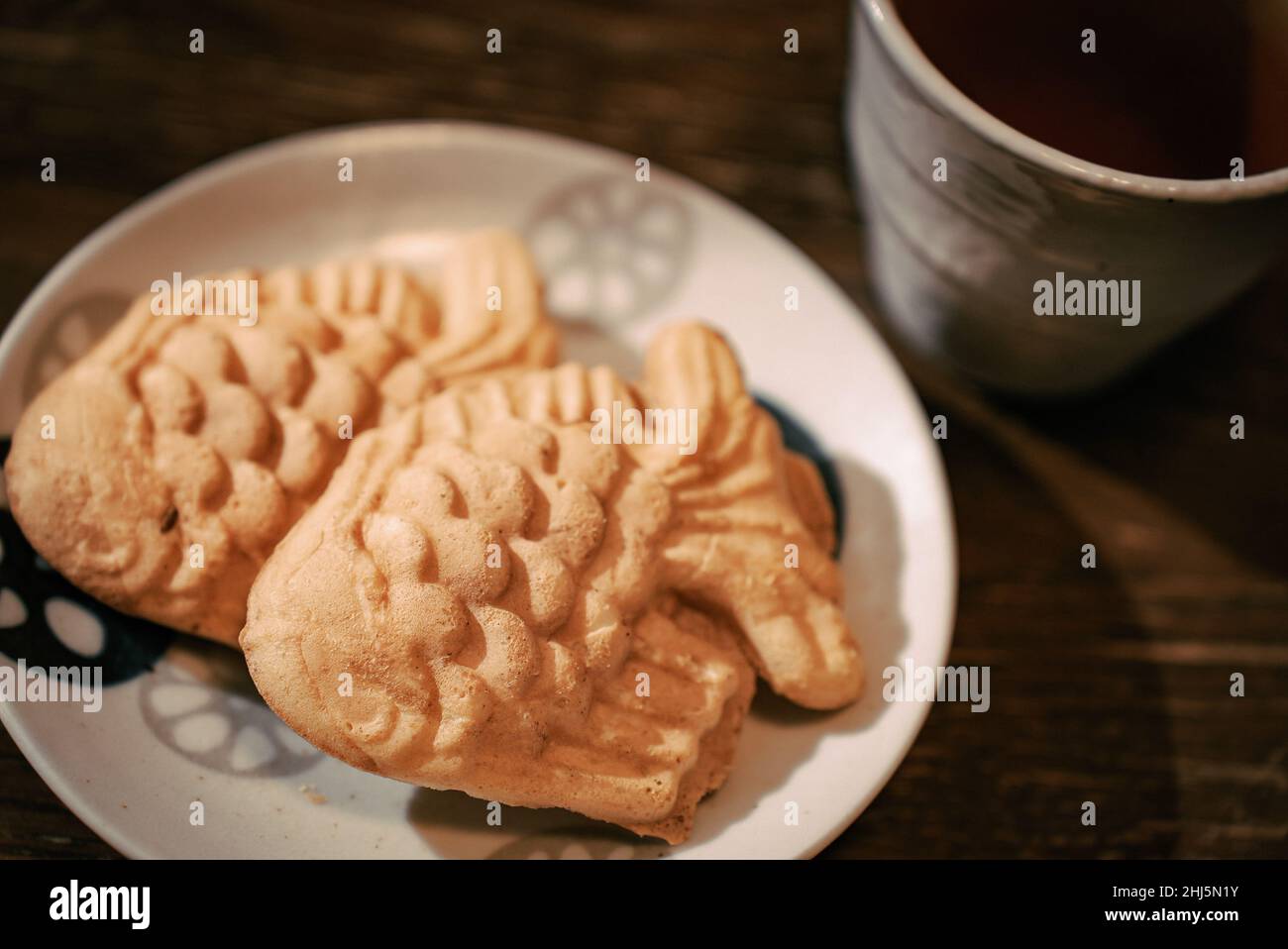 A decorated plate with 2 famous Japanese fish-shaped confections ...