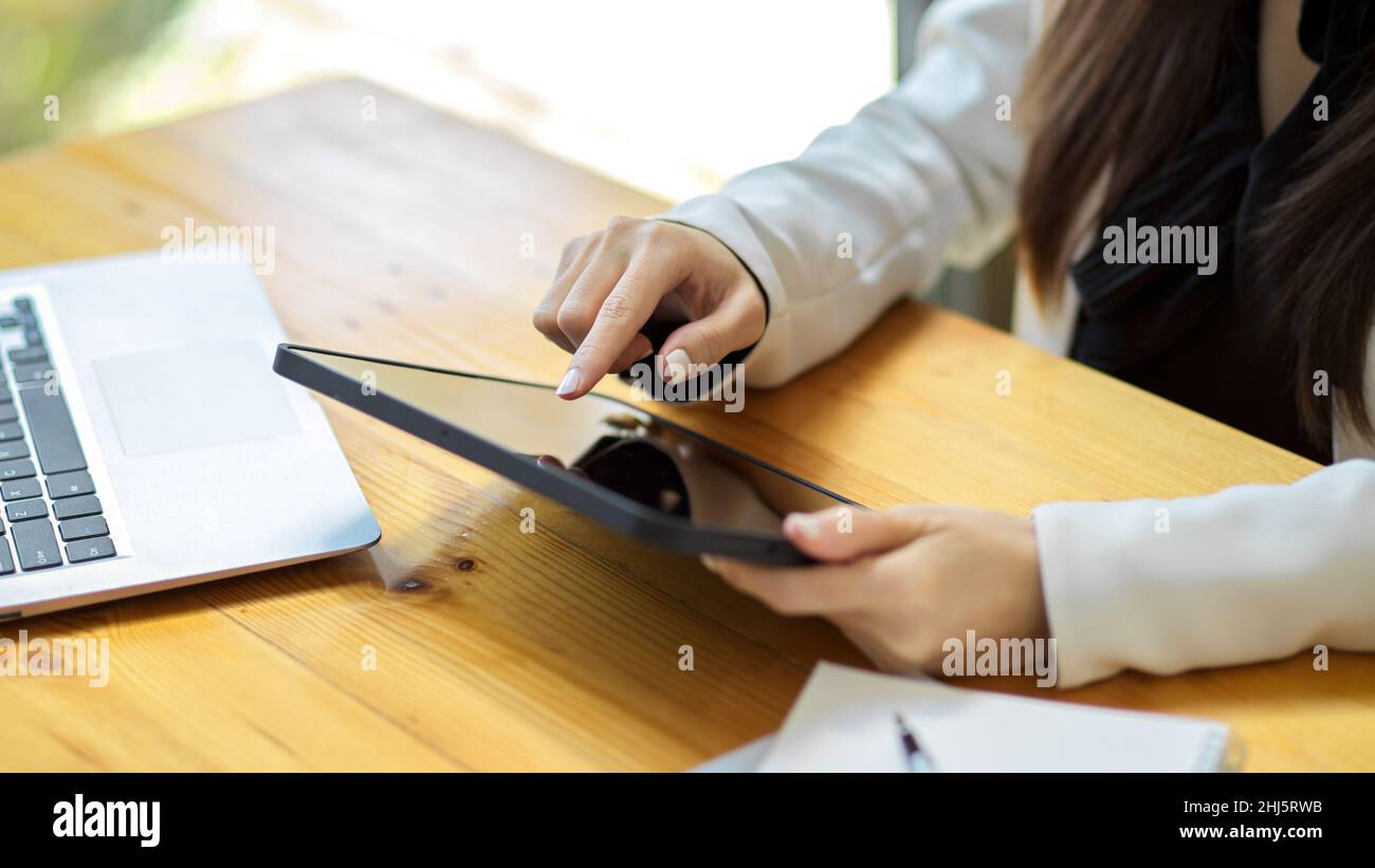 Close-up, Female touching on tablet screen, tapping her finger on ... Close-up, Female touching on tablet screen, tapping her finger on ...