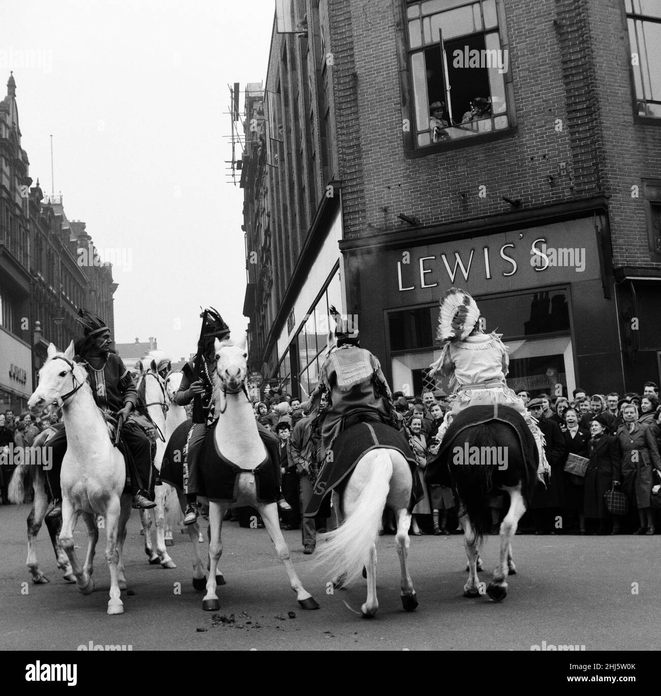 Cowboys and Indians from Billy Smarts Circus ride into town and stage a ...