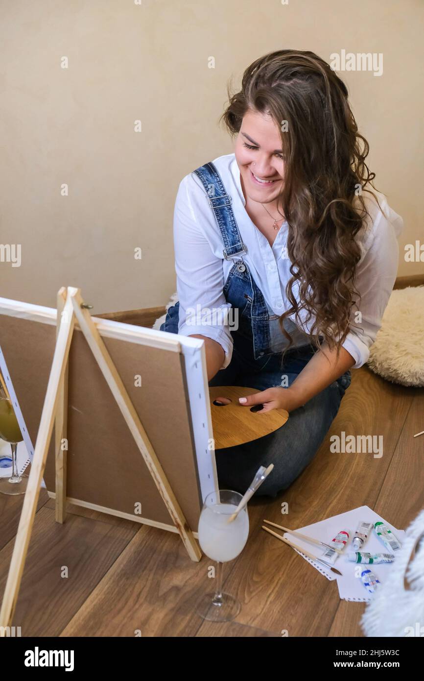 Creative painter in working process. Artist workplace, hobby, craft ...