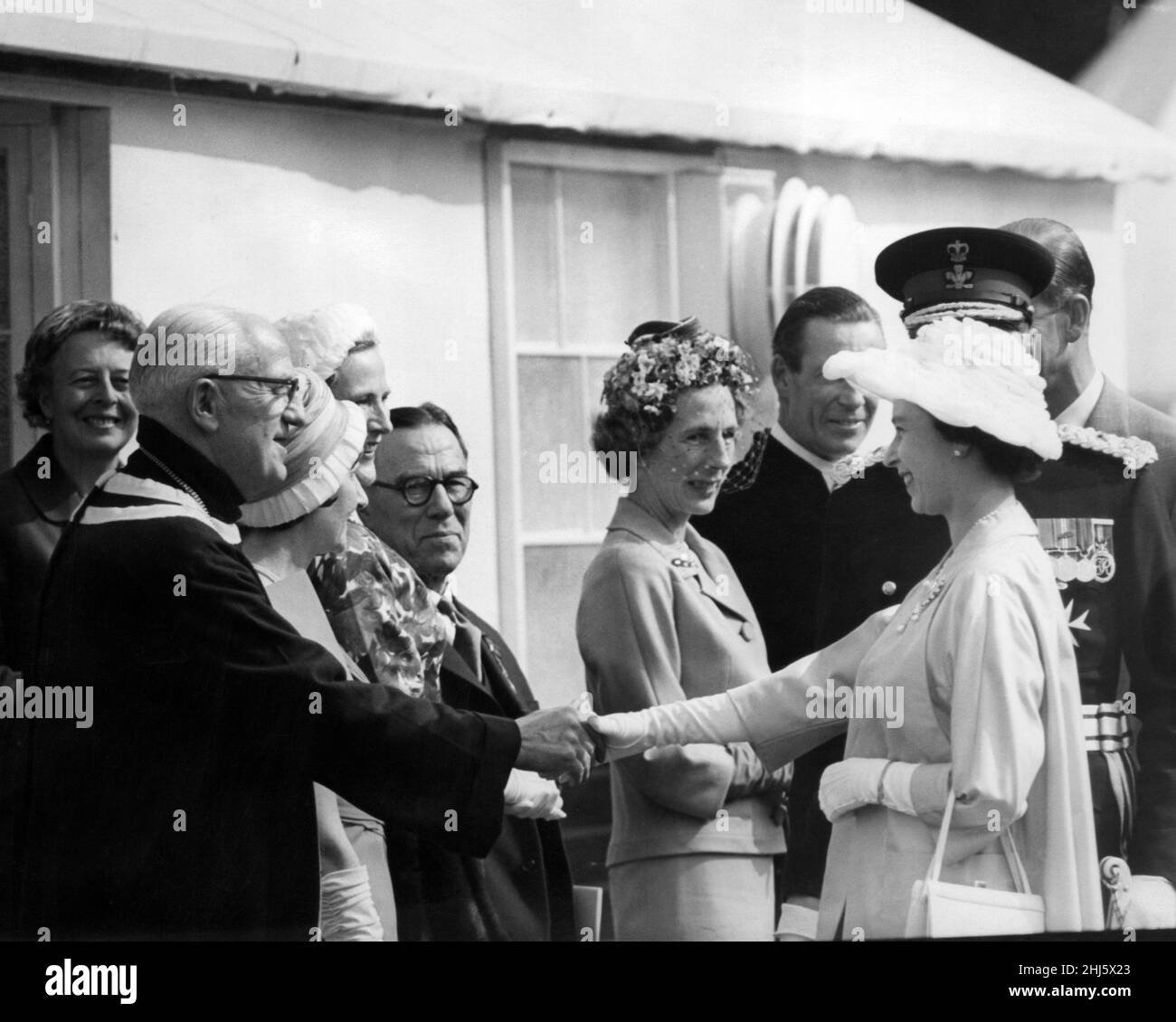 Queen Elizabeth II visiting Wales. The Queen shakes hands with Mr T W ...