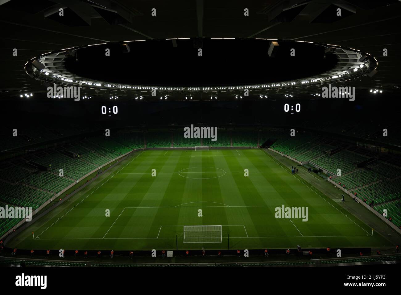 An open football stadium with empty stands with green seats Stock Photo ...