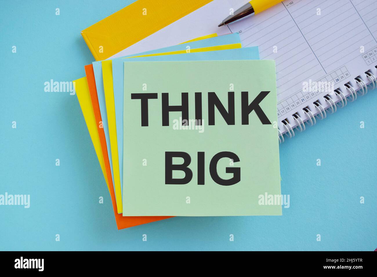 Think big motivational concept. On a light blue background.Symbol of ...