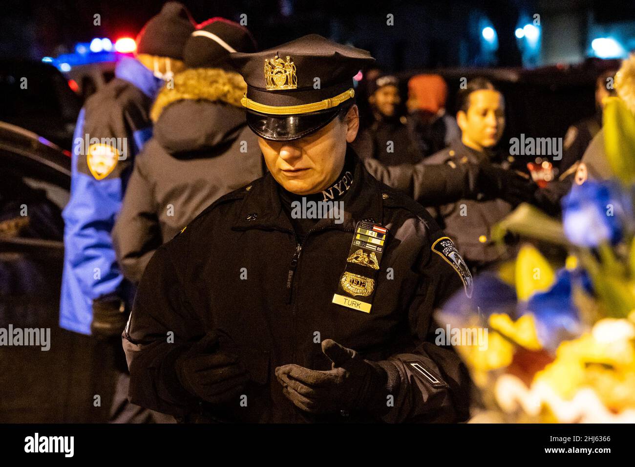 New York, USA. 12th Jan, 2022. An NYPD officer prays for fallen NYPD ...