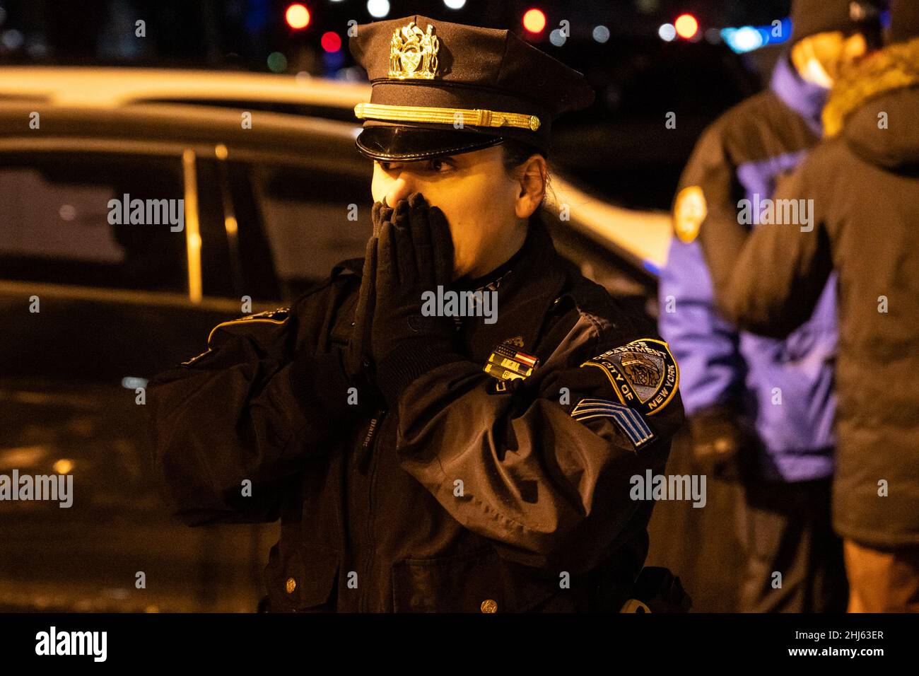 New York, USA. 12th Jan, 2022. An NYPD officer prays for fallen NYPD ...