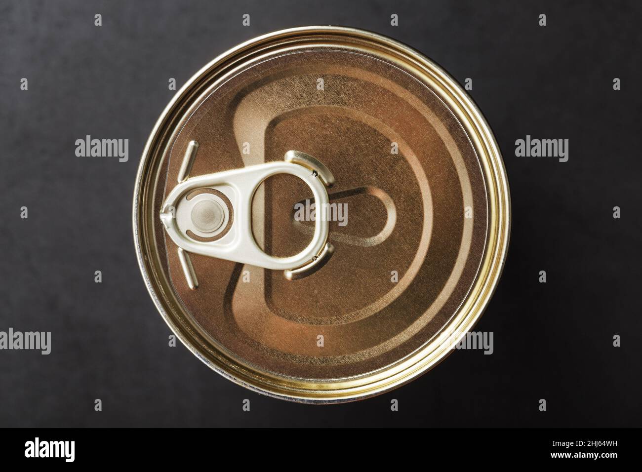 A can with a metal lid and a ring for opening. Top view Stock Photo - Alamy
