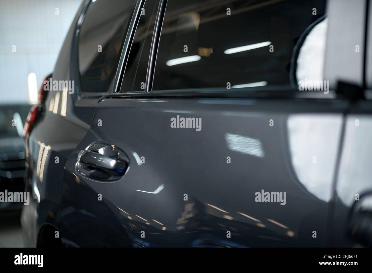 A view of dark gray car rear door and window Stock Photo - Alamy