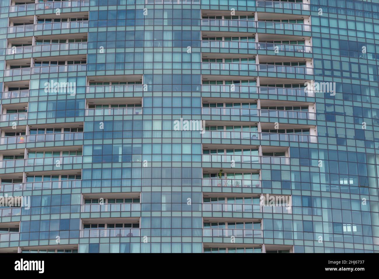 Glass windows of modern office building background Stock Photo - Alamy