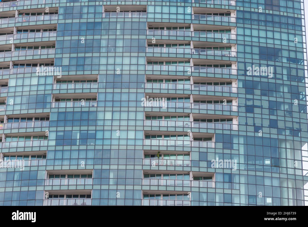 Glass windows of modern office building background Stock Photo - Alamy