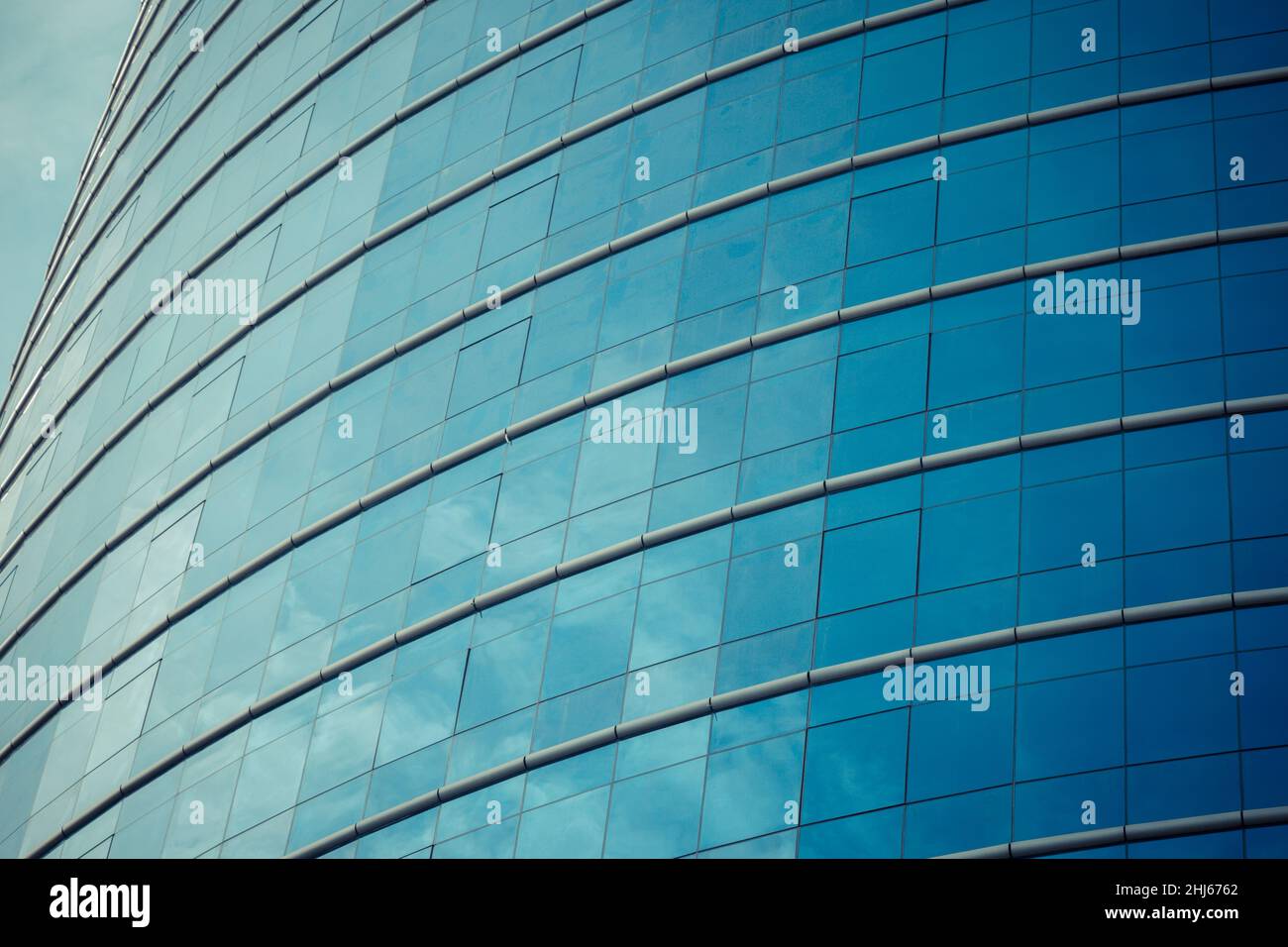 Glass windows of modern office building background Stock Photo - Alamy