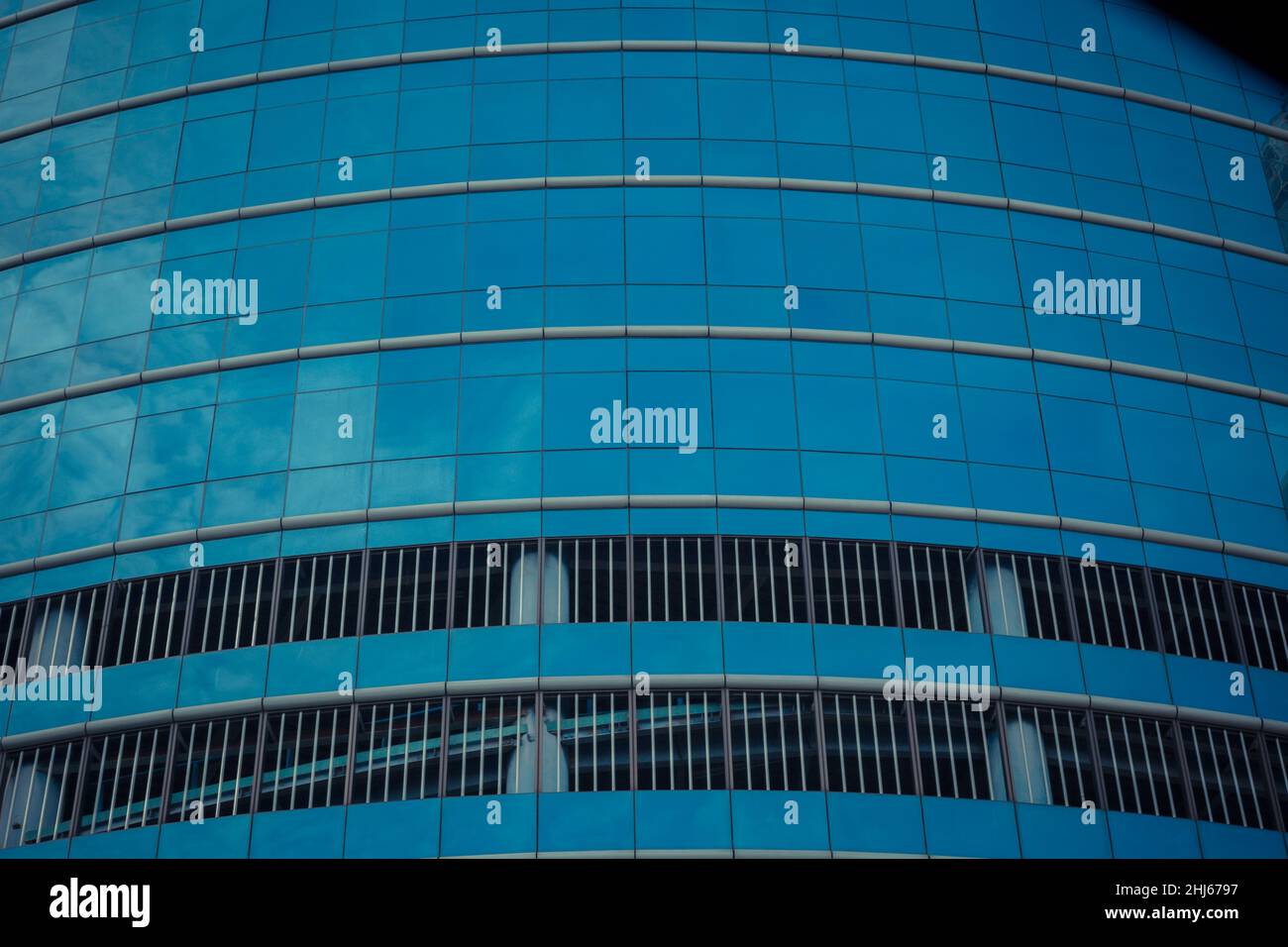 Glass windows of modern office building background Stock Photo - Alamy