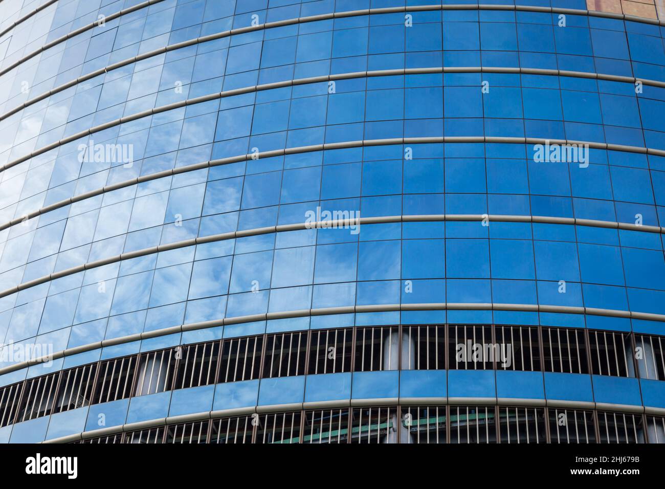 Glass windows of modern office building background Stock Photo - Alamy