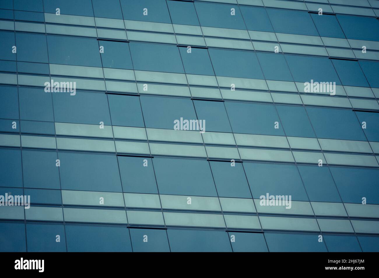 Glass windows of modern office building background Stock Photo - Alamy