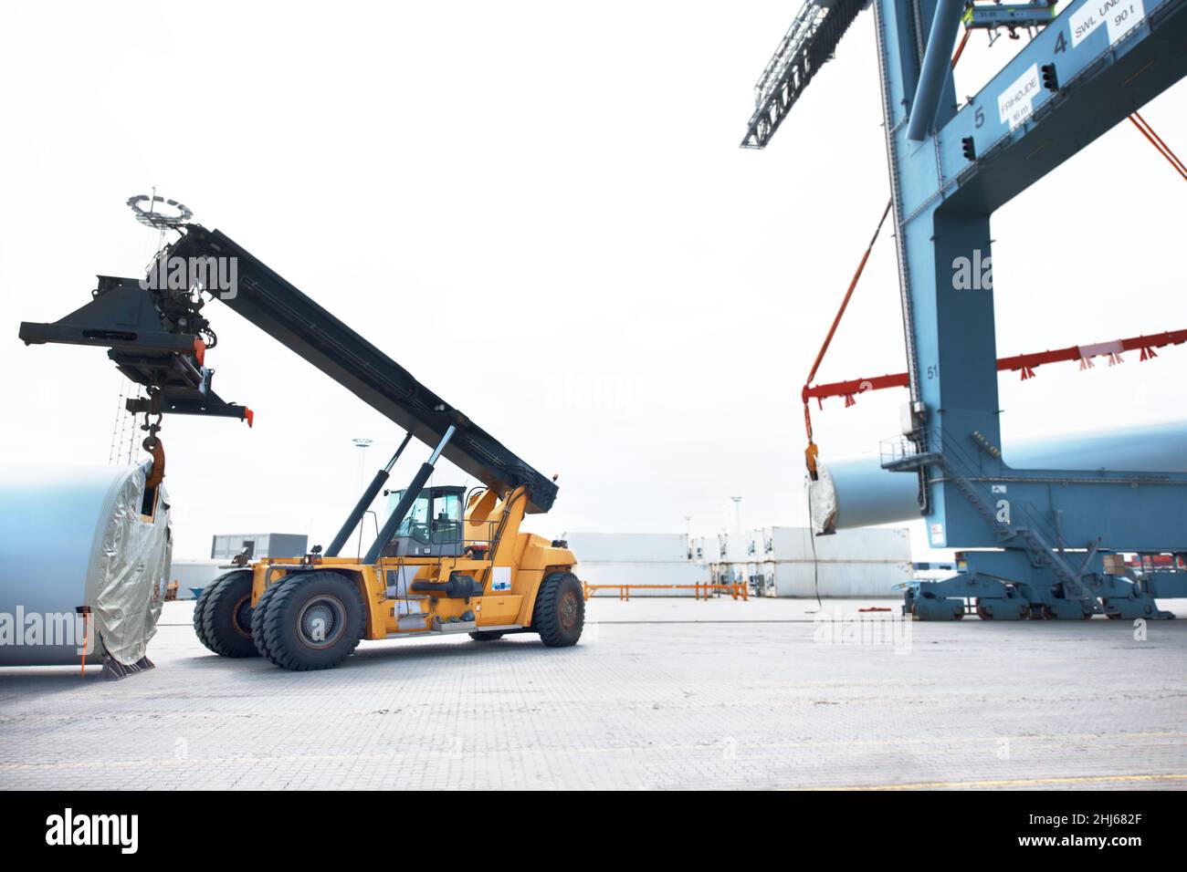 We handle the goods. A loader in a vehicle handling cargo in an ...