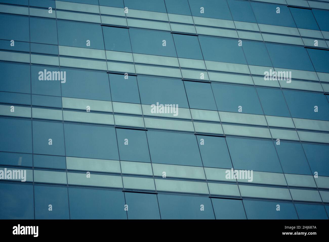 Glass windows of modern office building background Stock Photo - Alamy