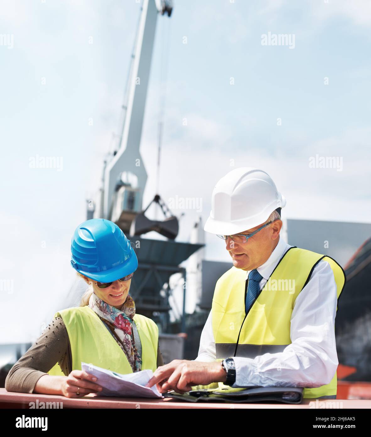 Working together can strengthen any foundation. Two dock workers ...