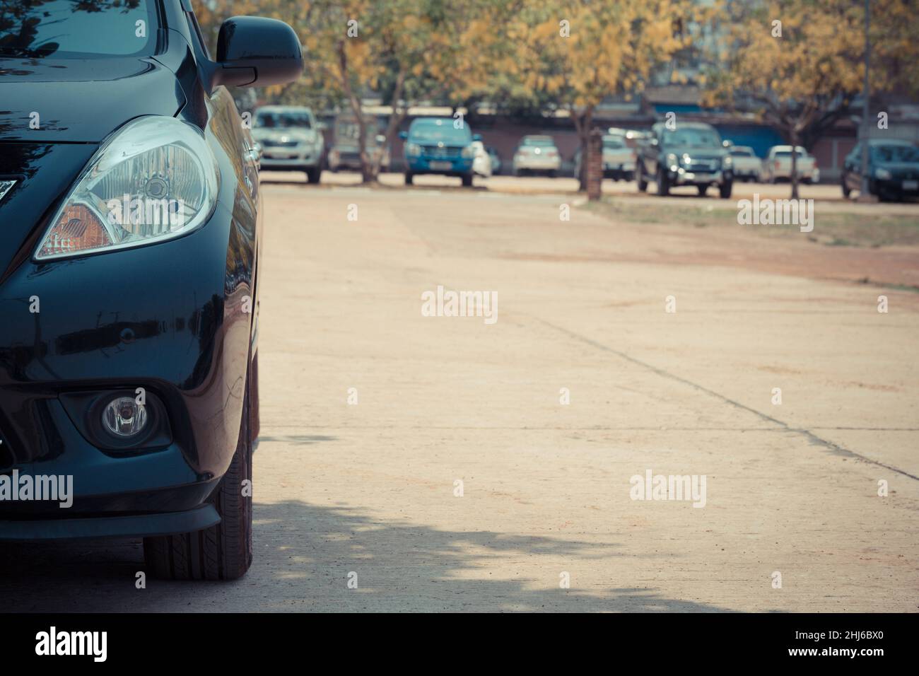Half front view of black car park on the car park background Stock ...
