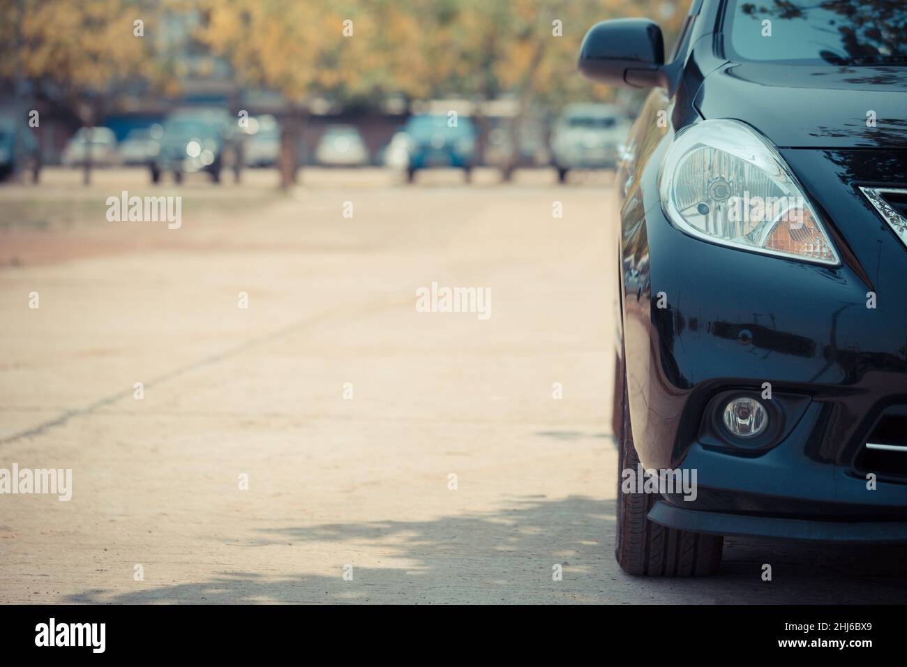 Half front view of black car park on the car park background Stock ...