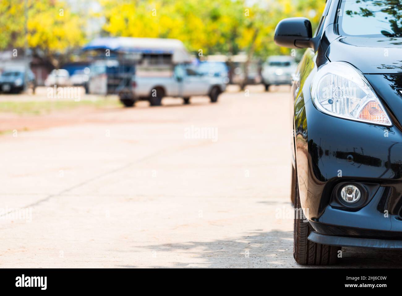 Half front view of black car park on the car park background Stock ...