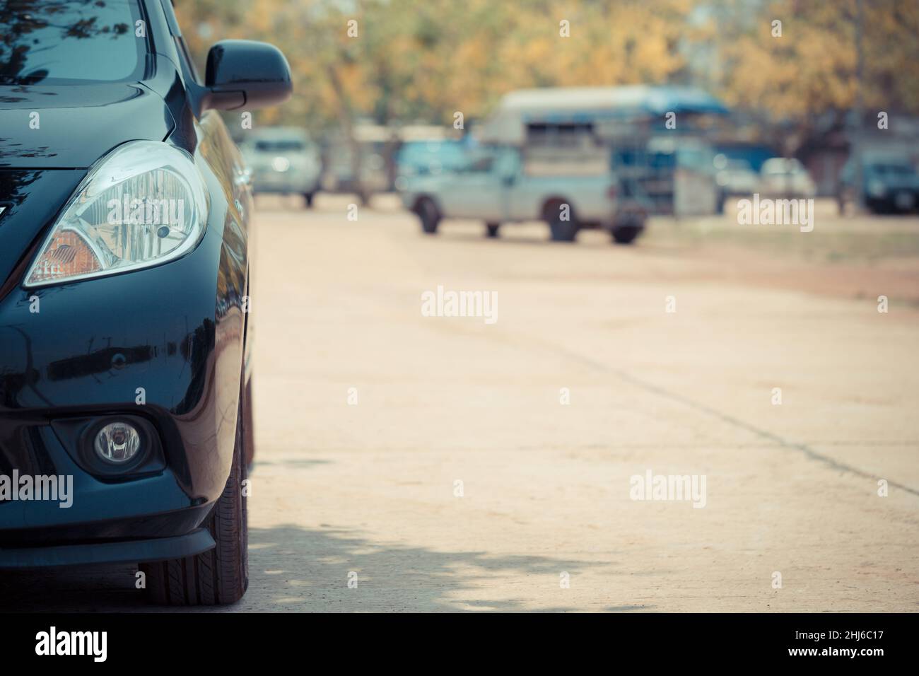 Half front view of black car park on the car park background Stock ...