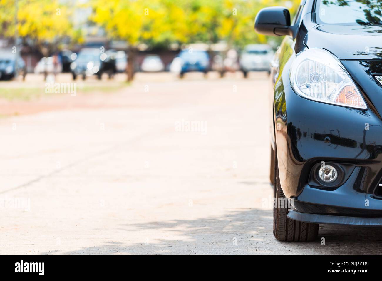 Half front view of black car park on the car park background Stock ...