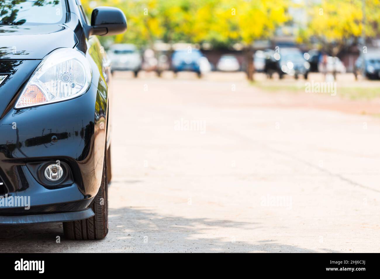 Half front view of black car park on the car park background Stock ...