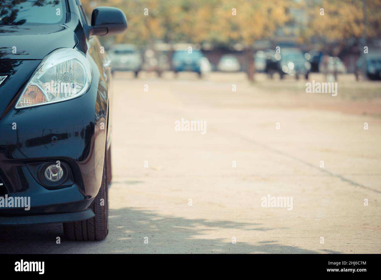 Half front view of black car park on the car park background Stock ...