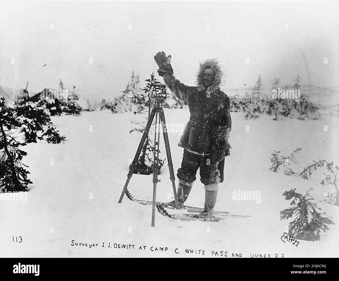 Surveyor JJ Dewitt at work for White Pass and Yukon Railroad, probably ...