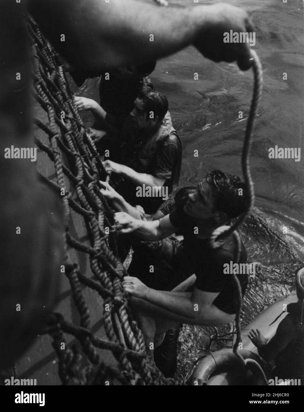Survivors of the German submarine U-515 climb aboard USS Chatelain (DE ...