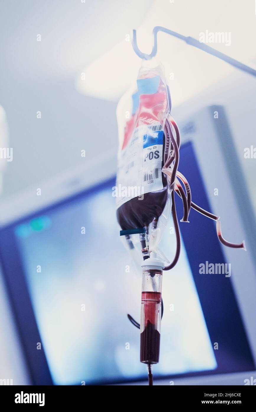 Save a life, donate blood. Low angle shot of blood in an iv drip at a ...