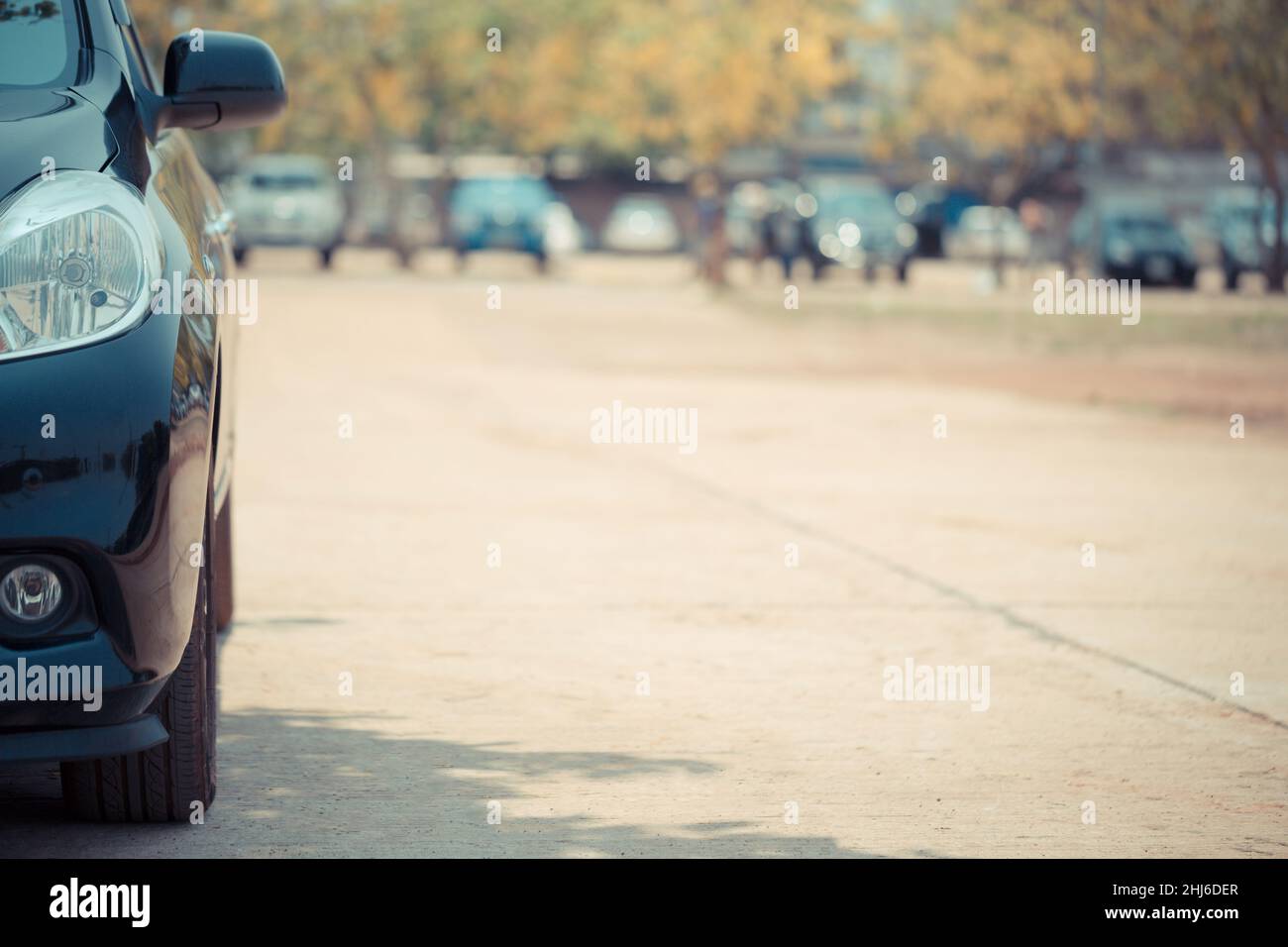 Half front view of black car park on the car park background Stock ...