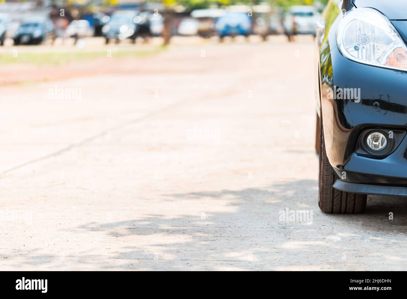 Half front view of black car park on the car park background Stock ...