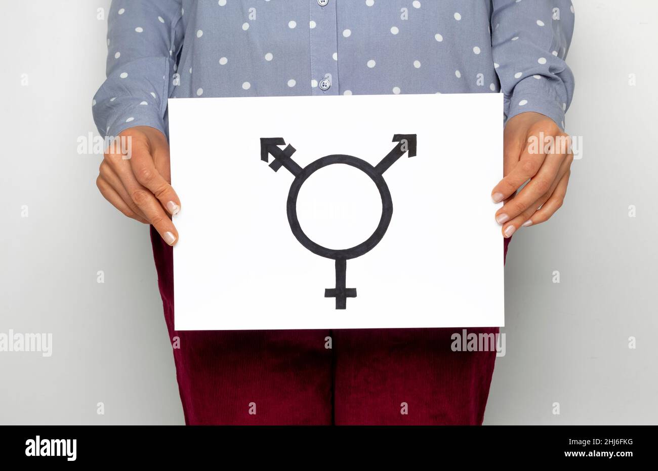 The concept of gender equality. Sign male and female symbol in hands ...