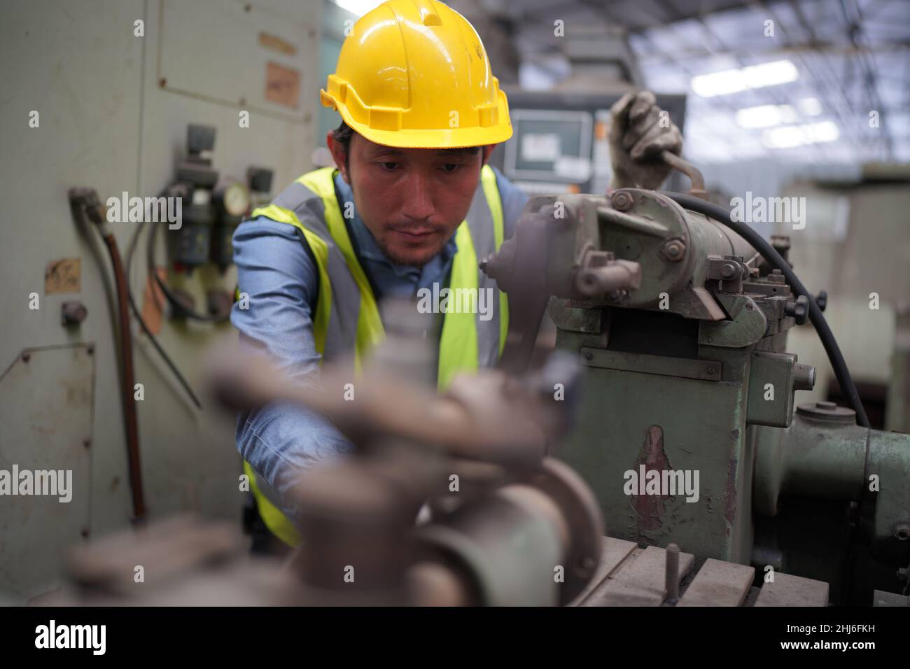 Production worker helmet hi-res stock photography and images - Alamy