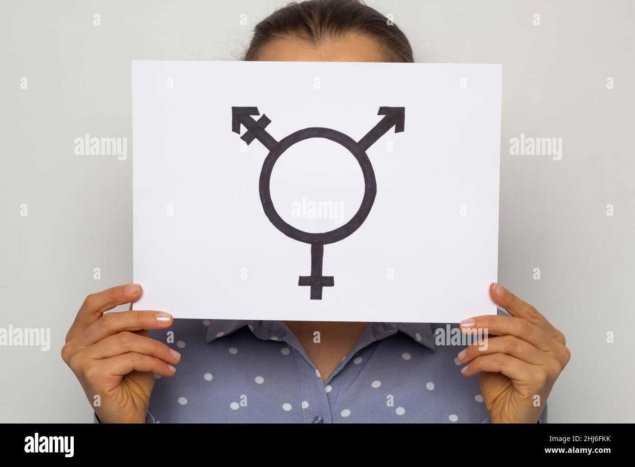 The concept of gender equality. Sign male and female symbol in hands ...