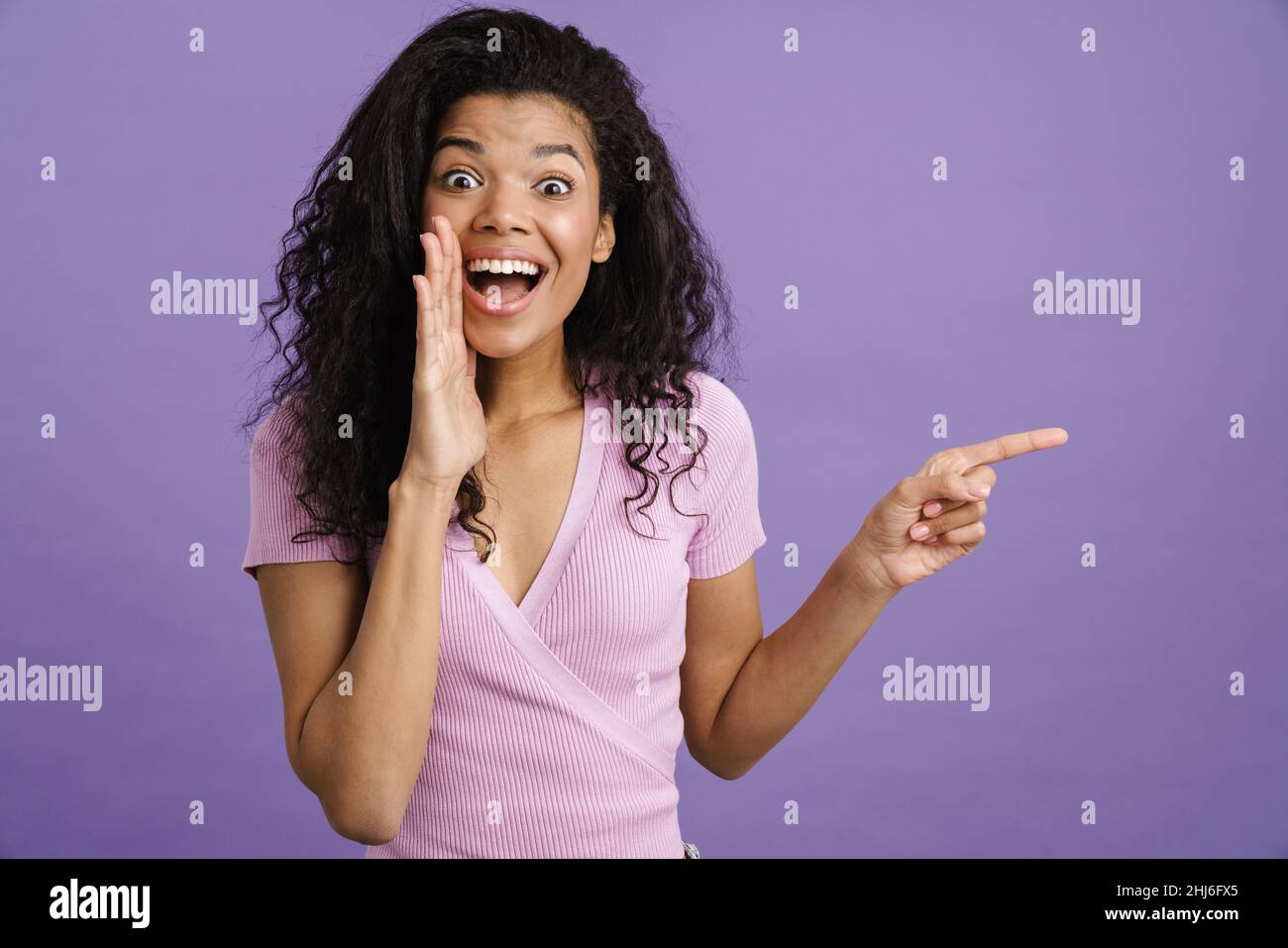 Whispering and pointing hi-res stock photography and images - Alamy