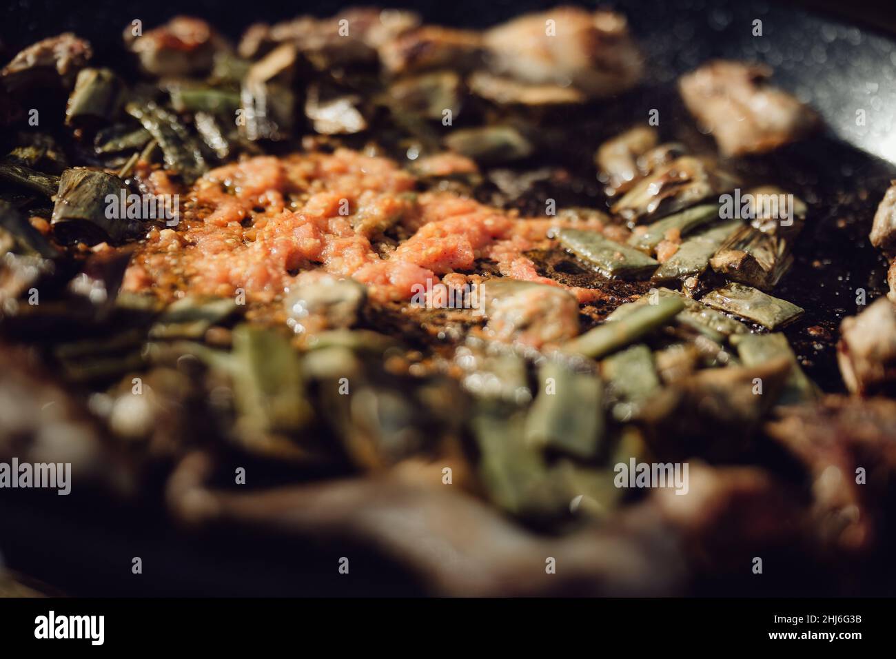 Closeup of a traditional Spanish meal with vegetables, chicken and ...