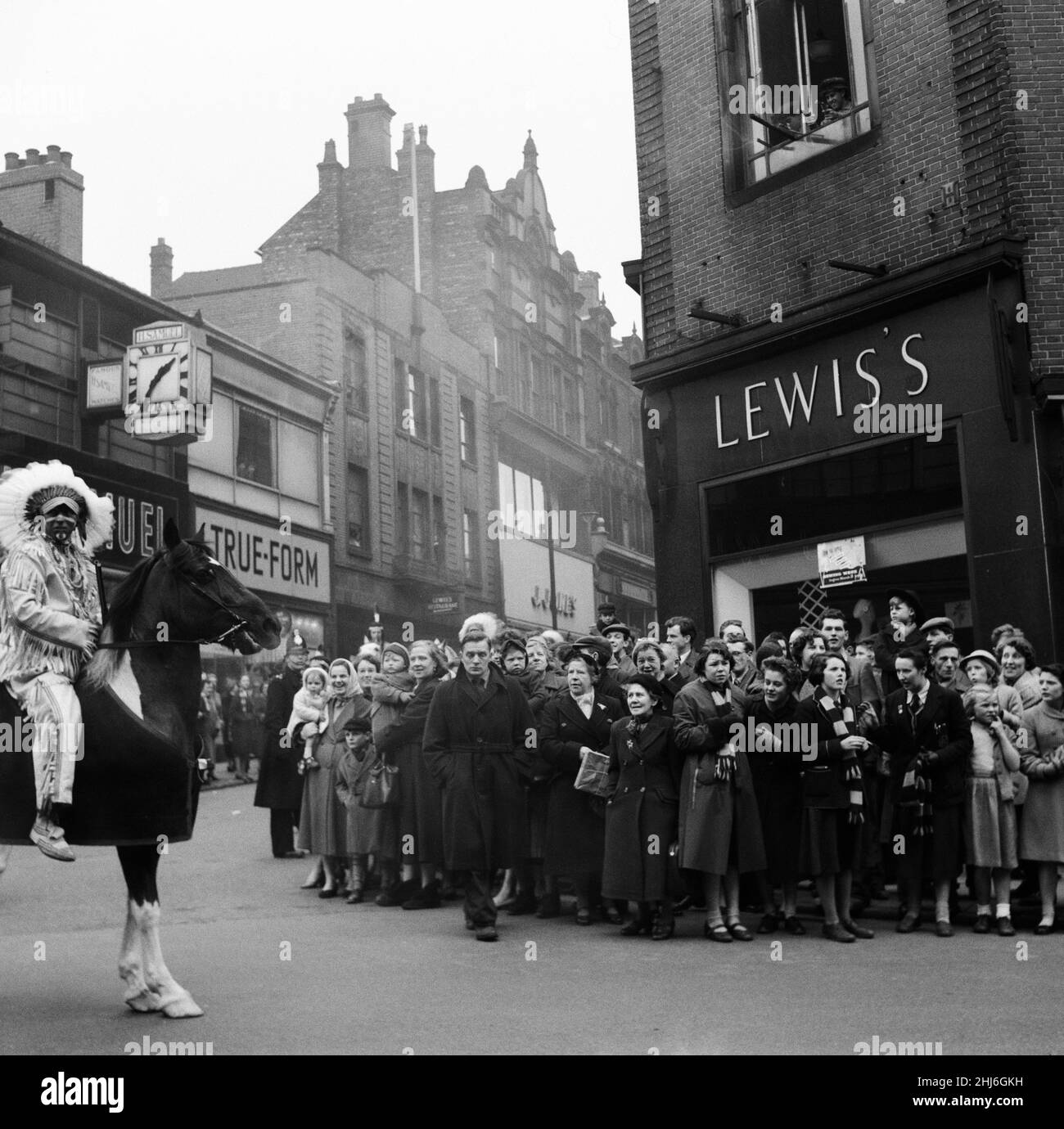 Cowboys and Indians from Billy Smarts Circus ride into town and stage a ...