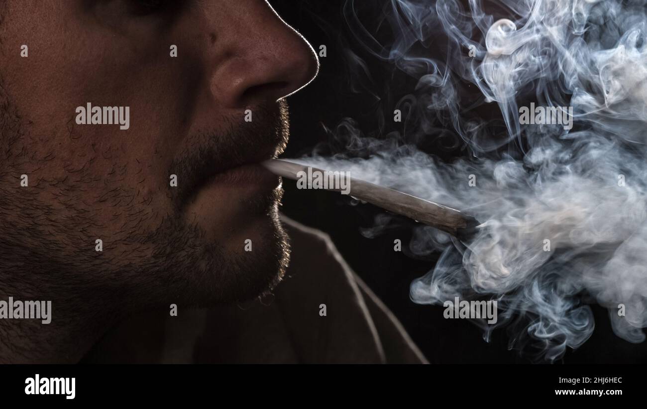 Woman Blowing Smoke Profile