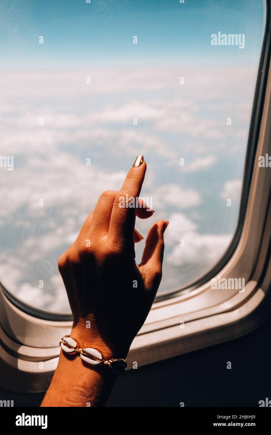 Female hand View from the window of the plane. Airplane, Aircraft ...