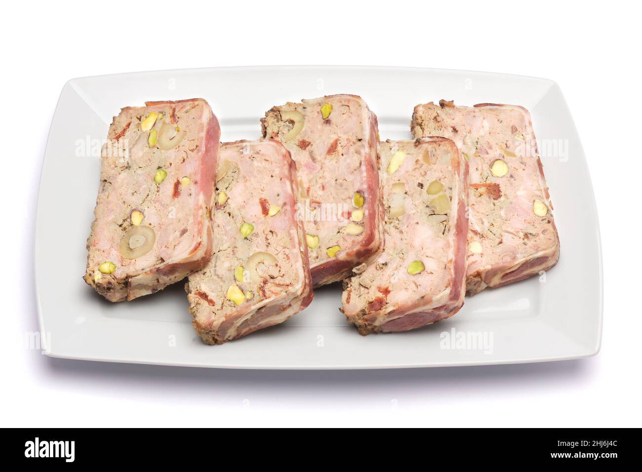 Sliced Traditional French terrine covered with bacon isolated on white ...