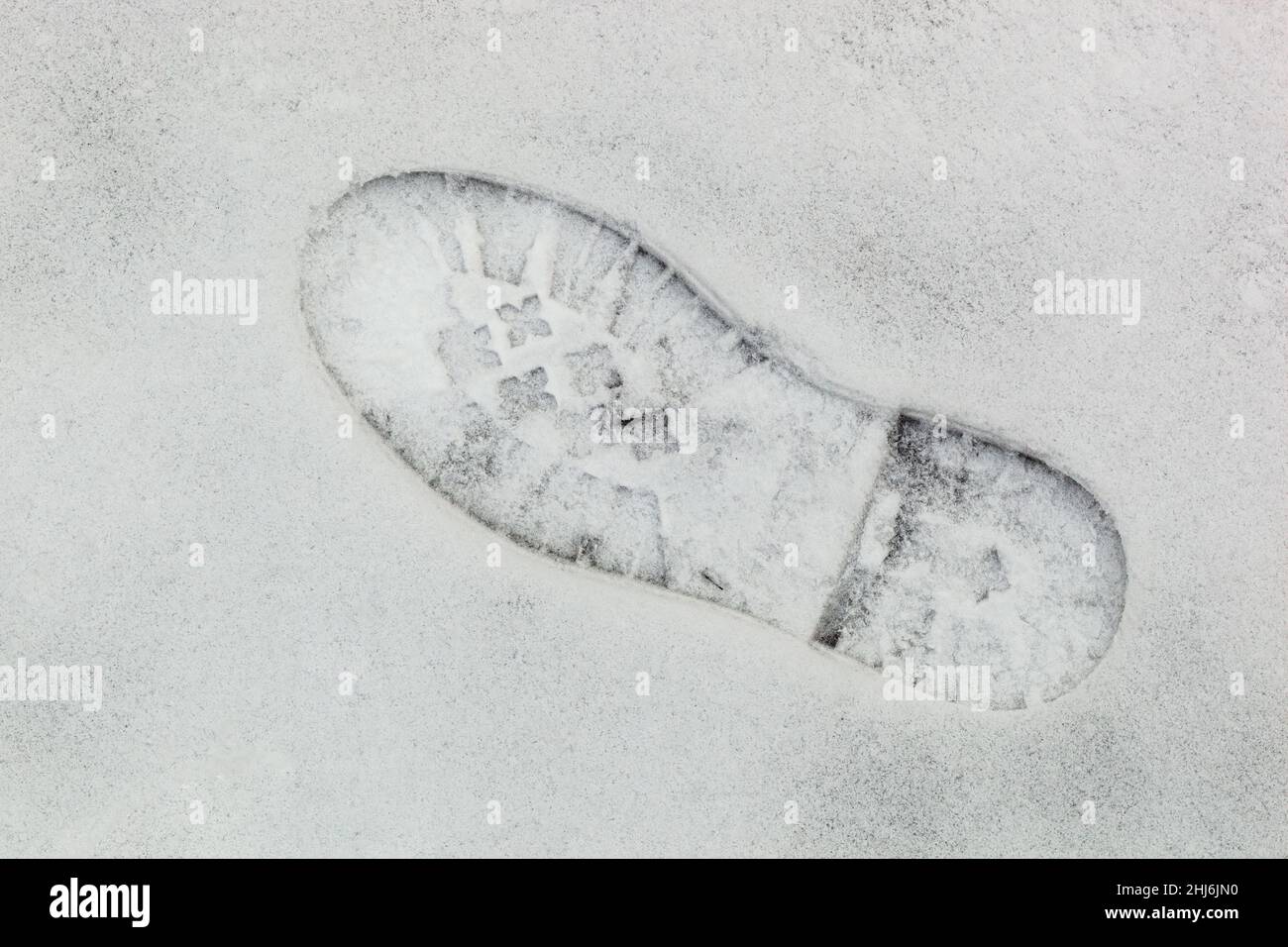 Hiking shoe track on snow Stock Photo - Alamy