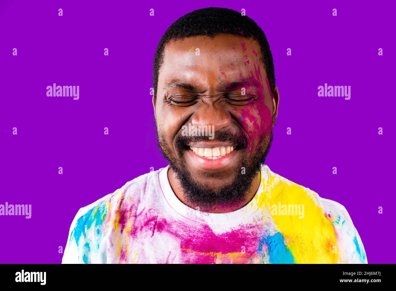 latin brazilian male in white cotton t-shirt with colorful paint of ...