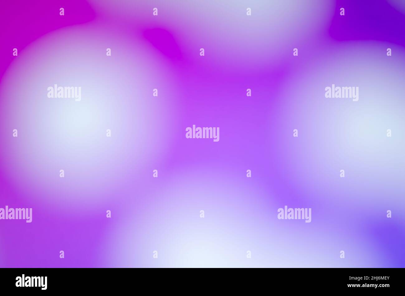 Abstract background with blurry blobs of colour and light with copy ...