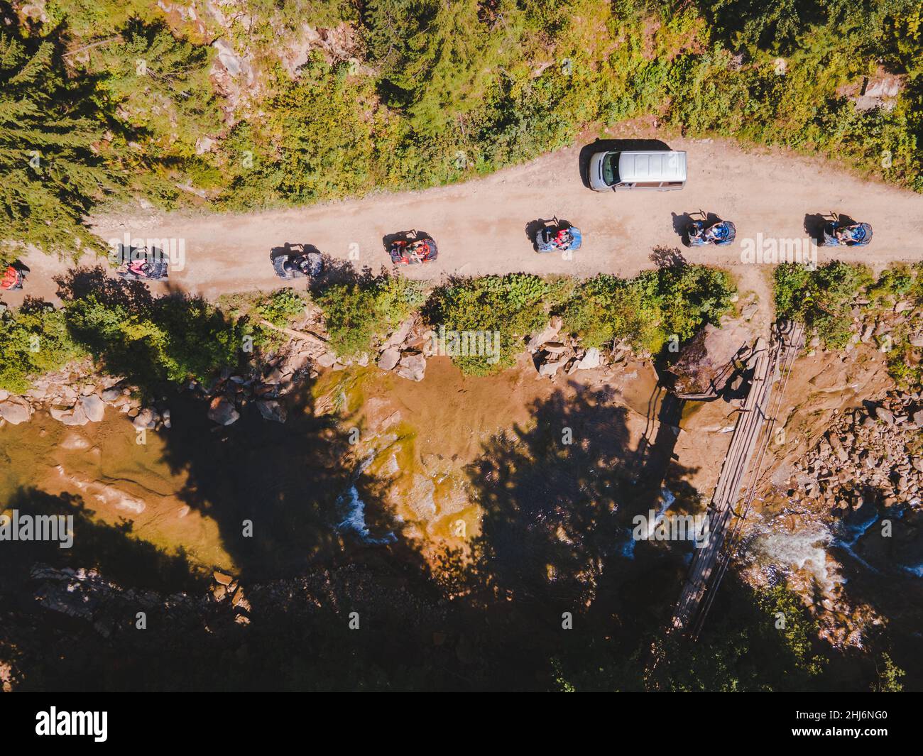 aerial view of quad bike riders at mountain trail road copy space Stock ...